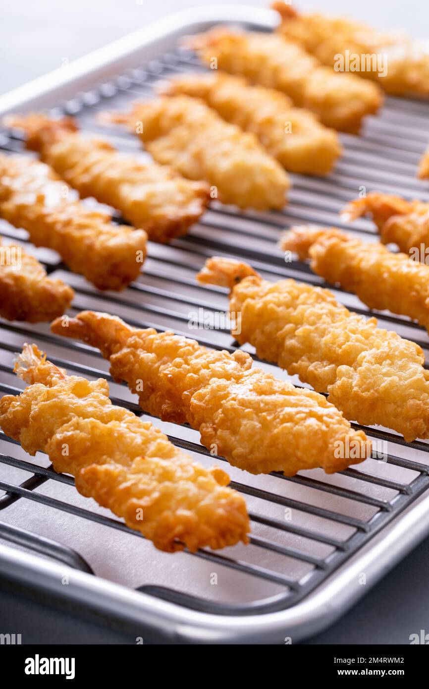 Tempura shrimp just cooked on a cooling rack ready to be served Stock ...