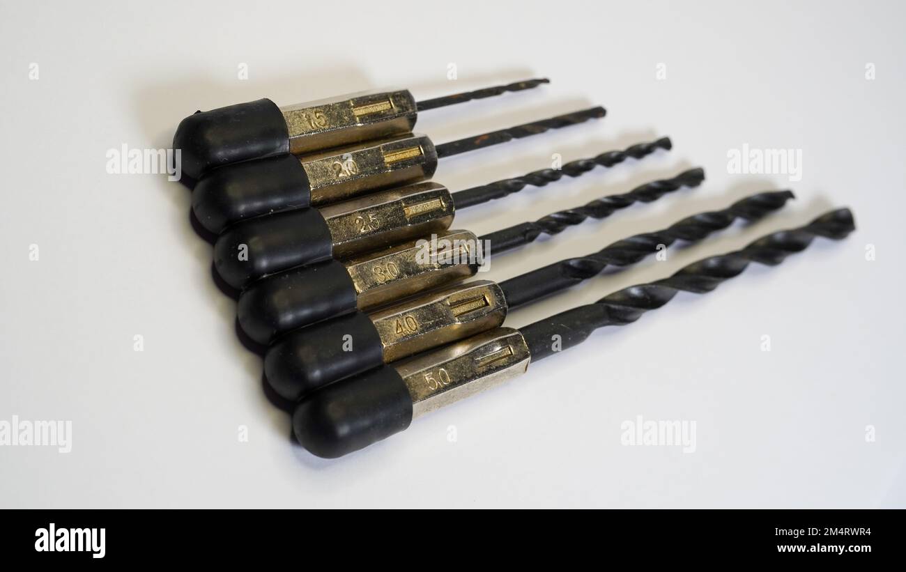 Iron drill bit made of brass with isolated focus concept on white ...