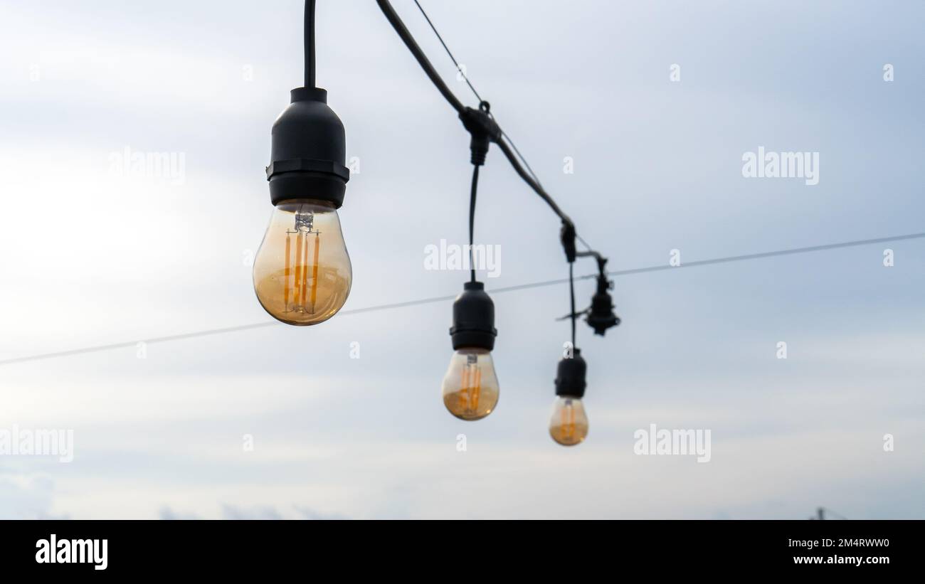 Clear incandescent light bulb with isolated focus Stock Photo - Alamy