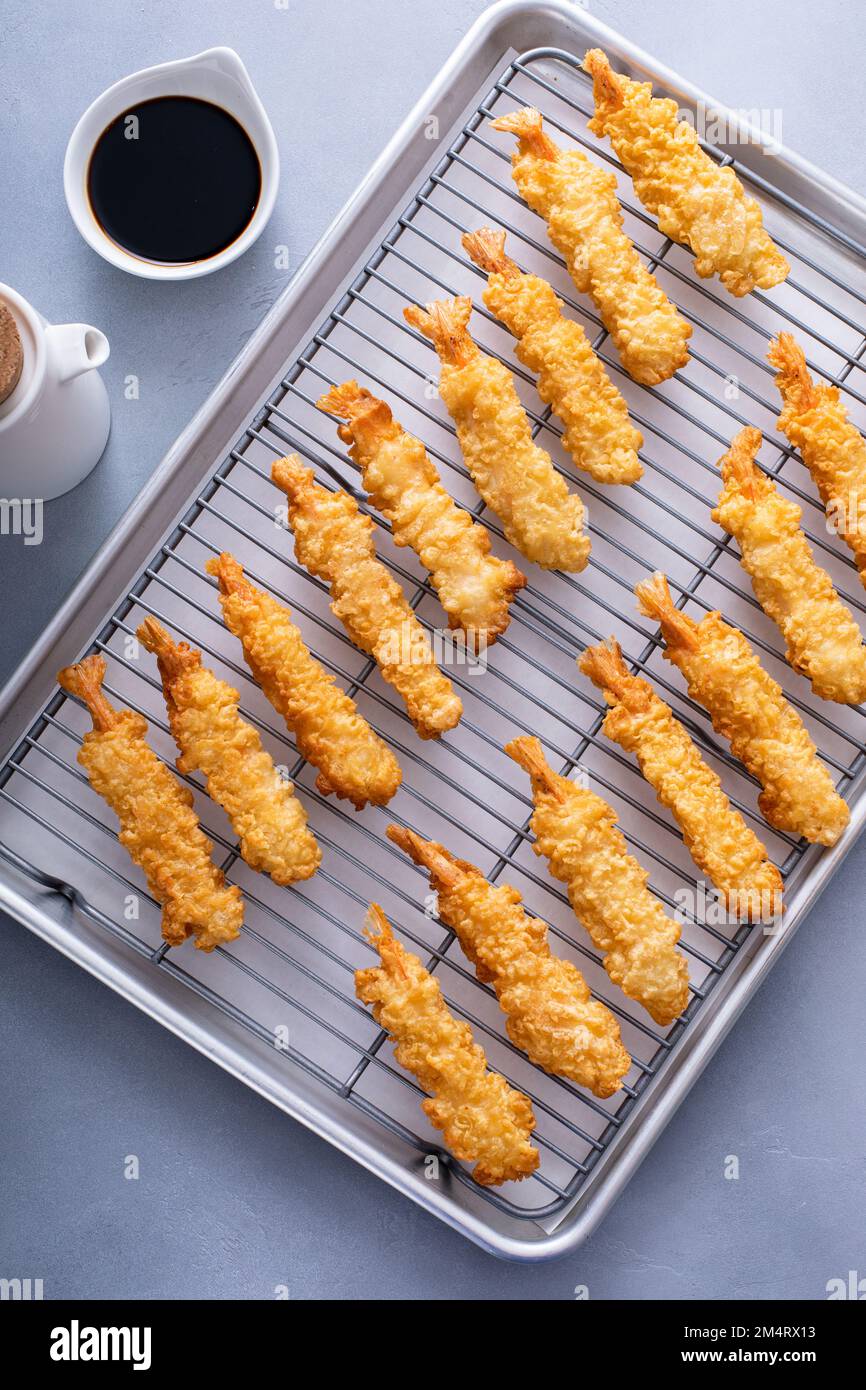 Tempura shrimp just cooked on a cooling rack ready to be served Stock ...