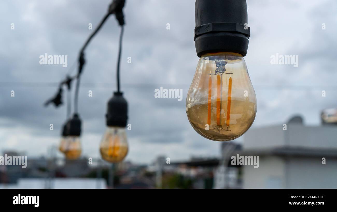 The lights are hung in the afternoon. The lights are on. Rows of lights ...