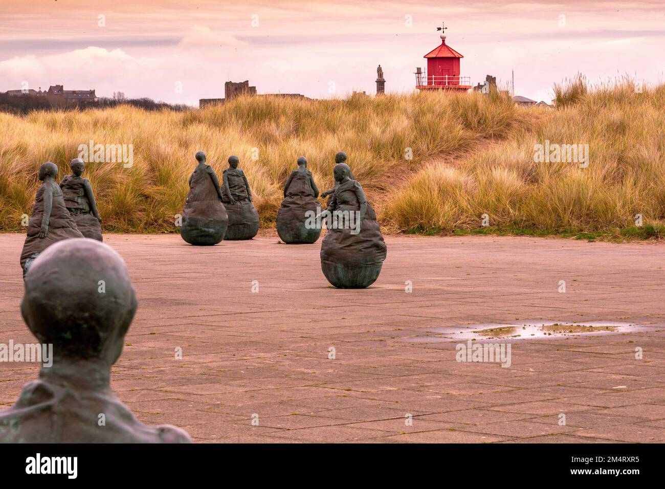 A scenic view of the Weebles sculpture during a colorful sunset in ...