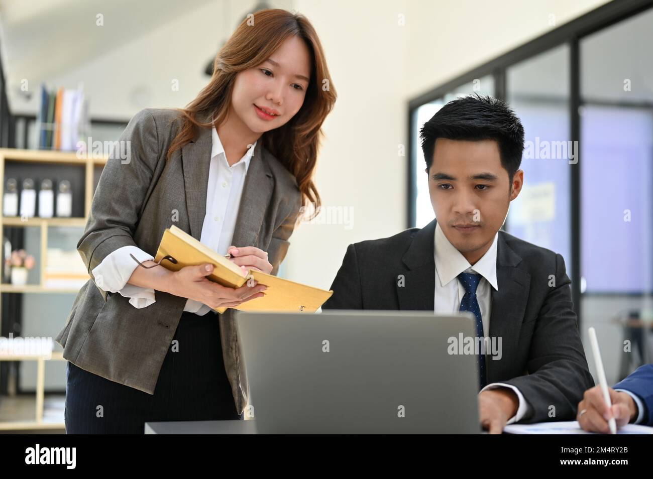 Male boss talking secretary hi-res stock photography and images - Alamy