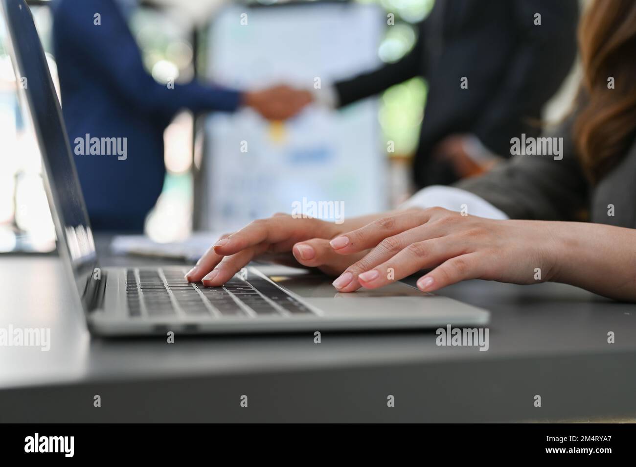 close-up, side view image, A businesswoman using laptop computer ...