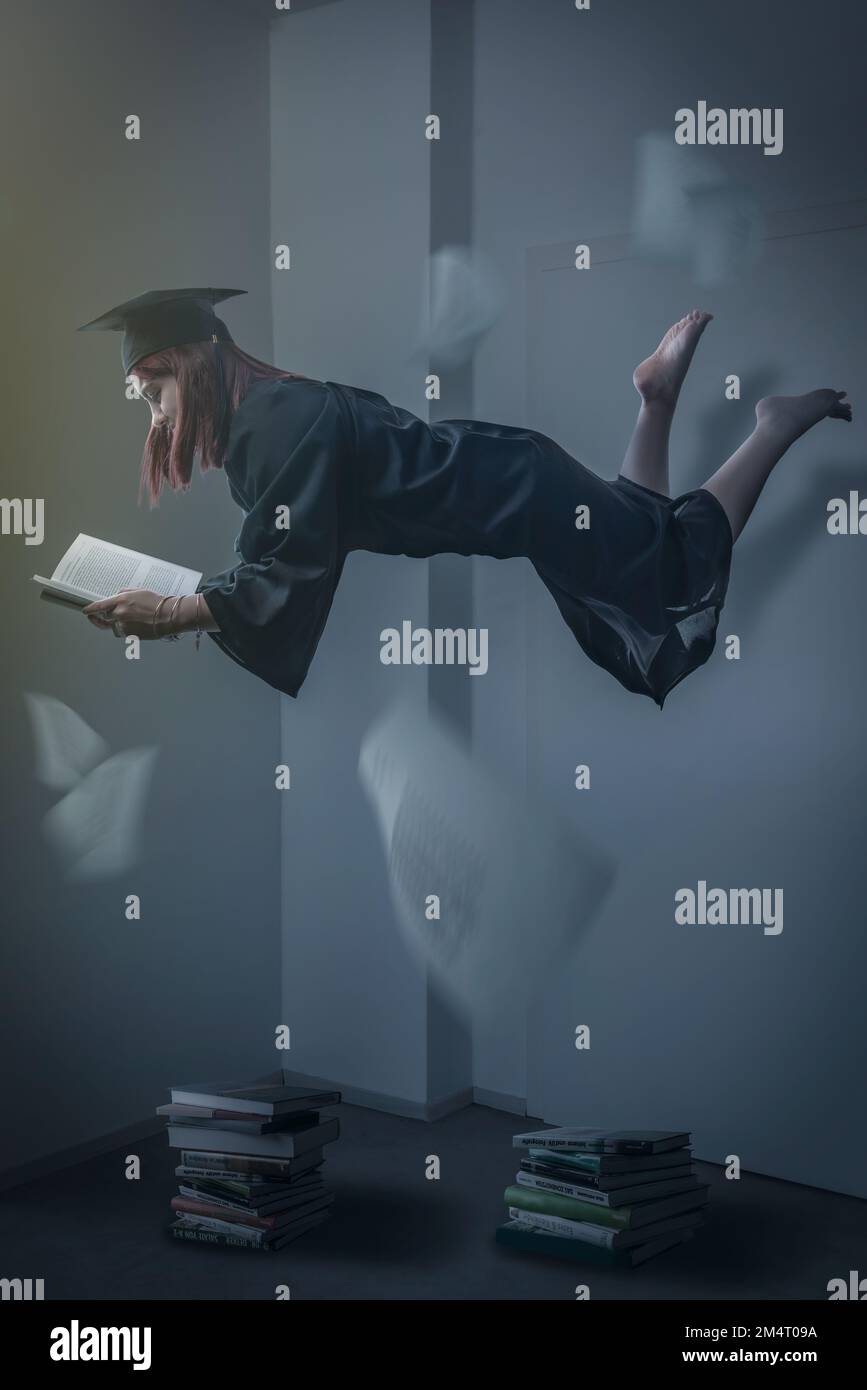 A female student floating in the air above stacks of books while ...