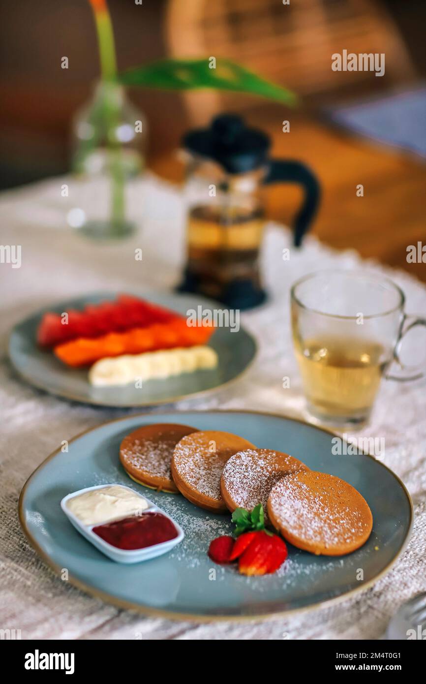 Close-up of pancake with strawberries arranged in plate at cafe Stock ...