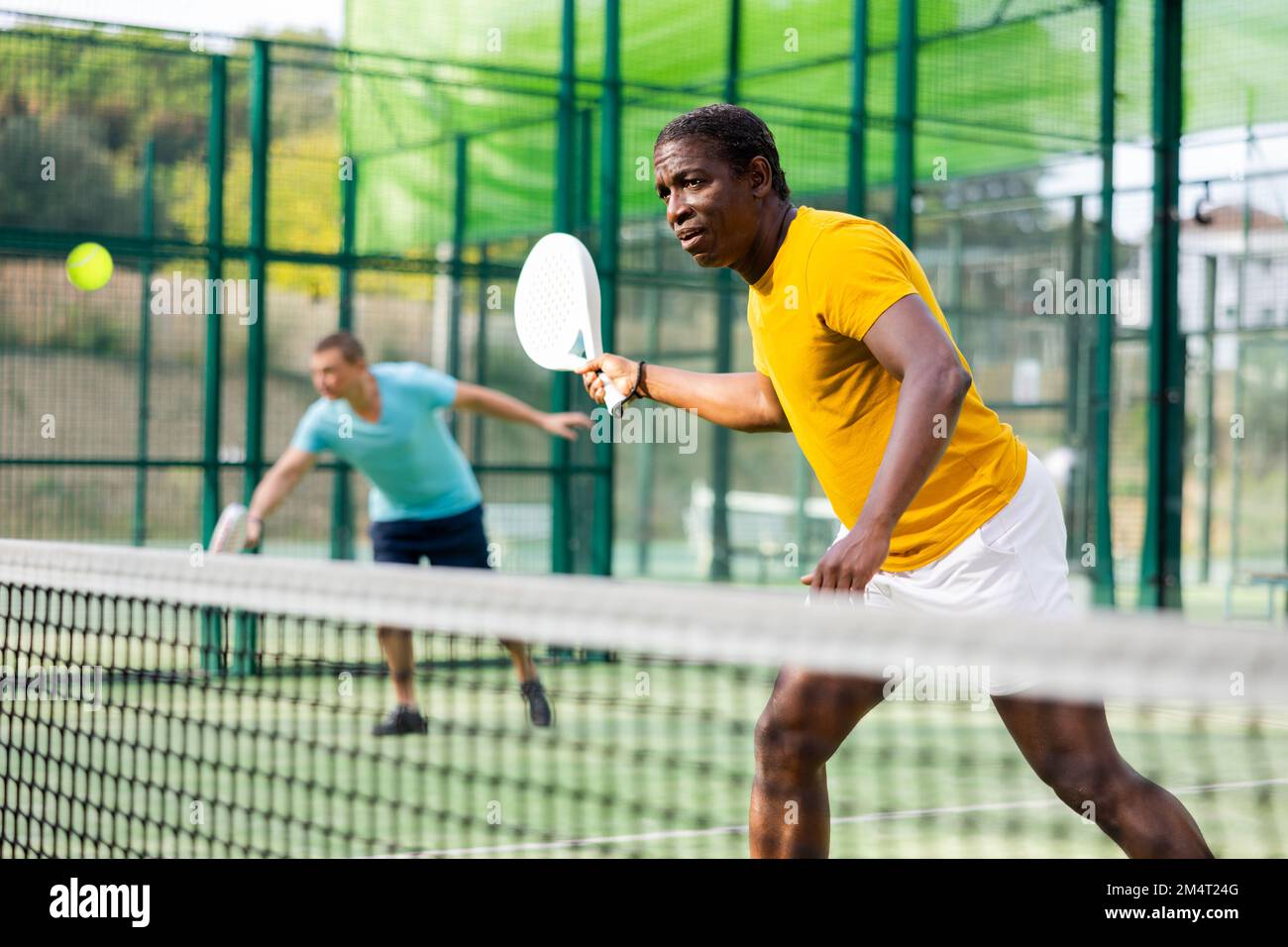 Male padel tennis player training on court Stock Photo - Alamy