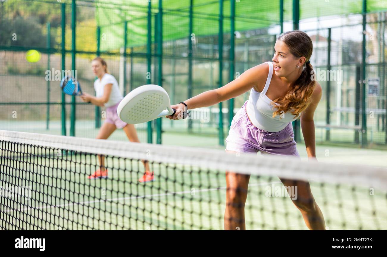 Woman padel tennis player training on court Stock Photo - Alamy