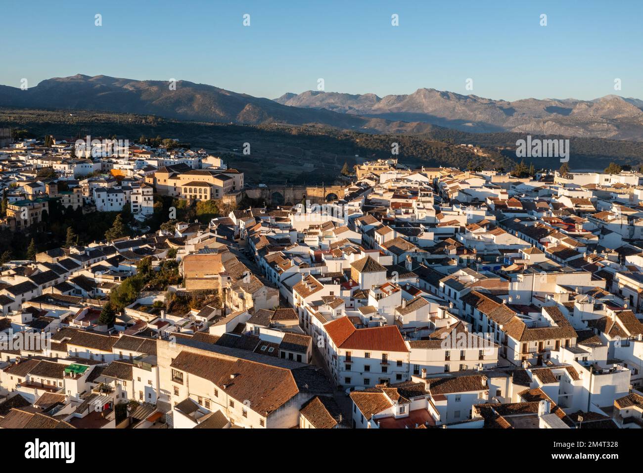 Rocky landscape of Ronda city with Puente Nuevo Bridge and buildings ...