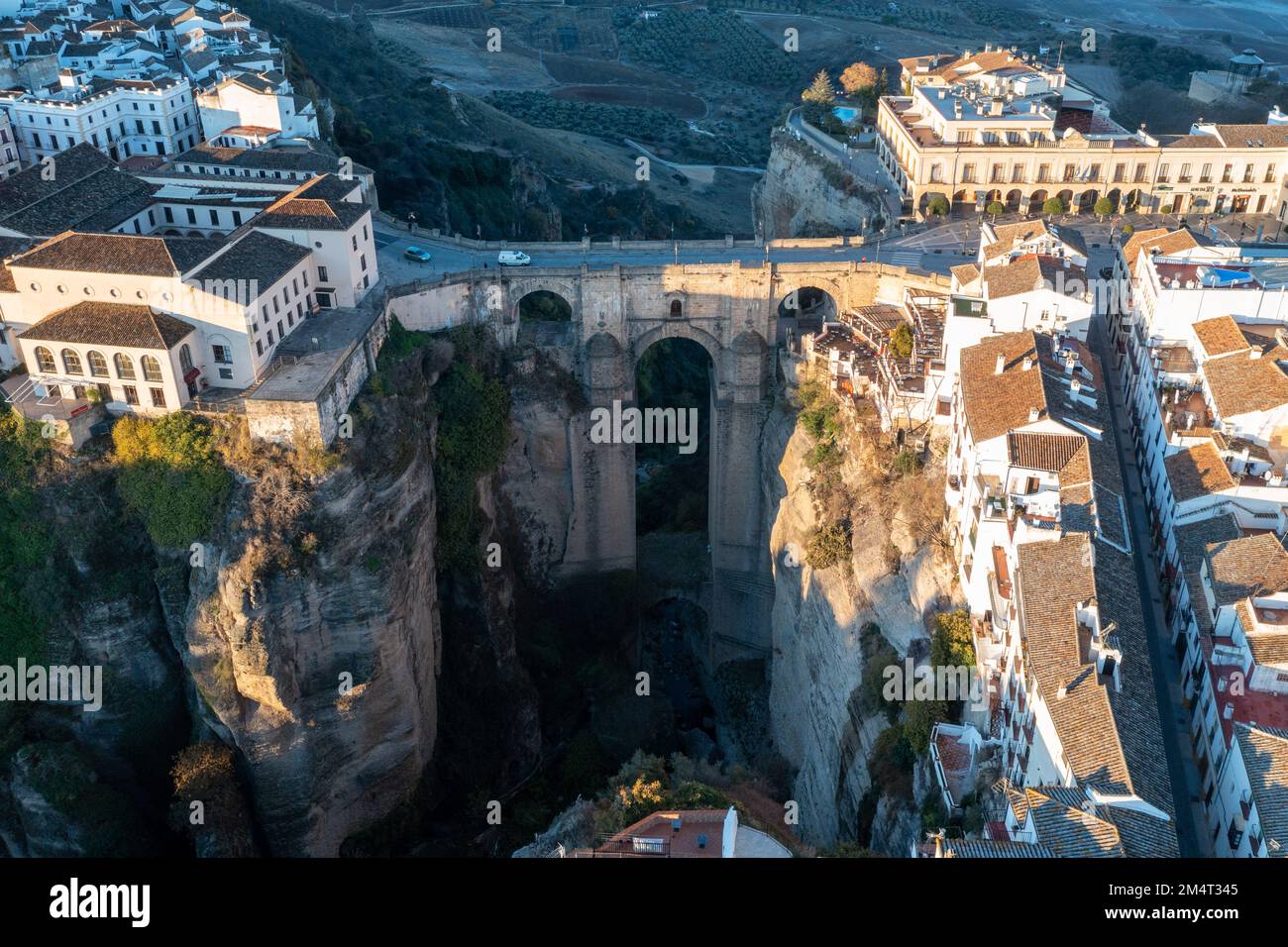 Rocky landscape of Ronda city with Puente Nuevo Bridge and buildings ...