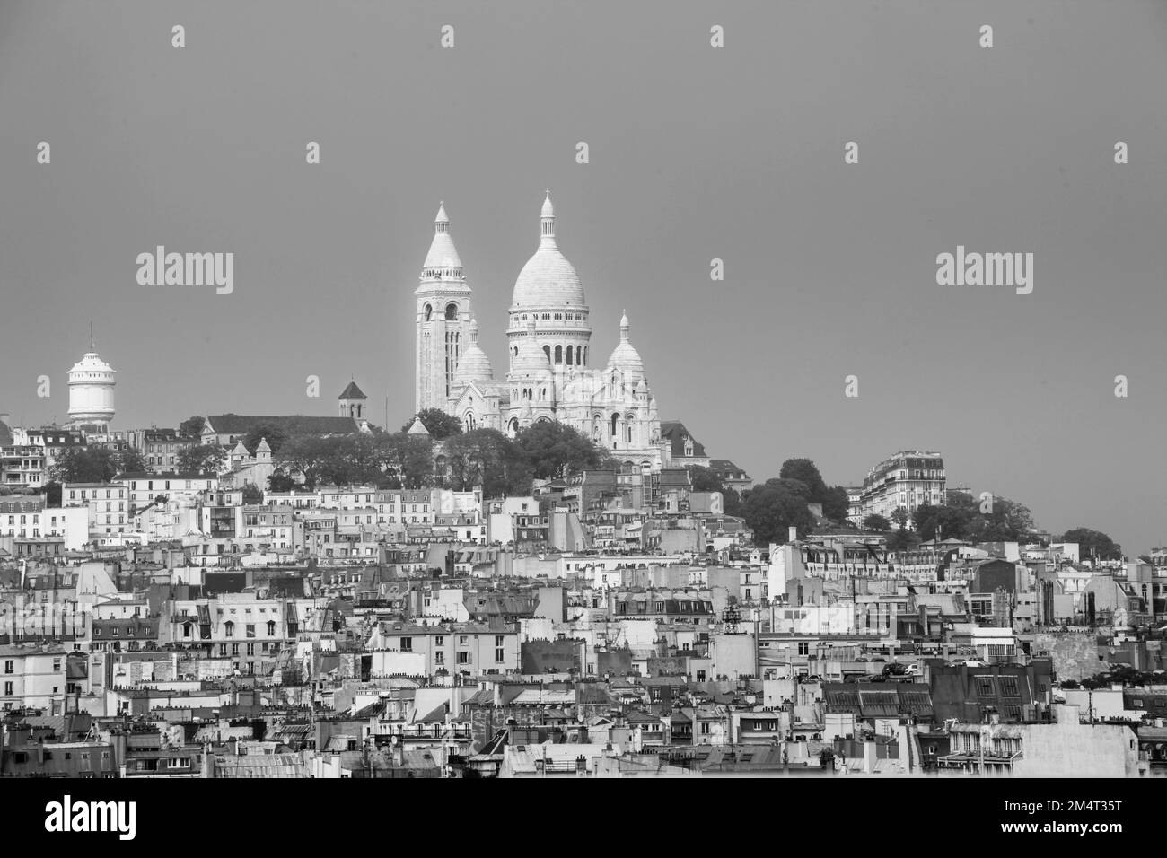 A grayscale shot of Montmartre - a large hill in Paris, France Stock ...