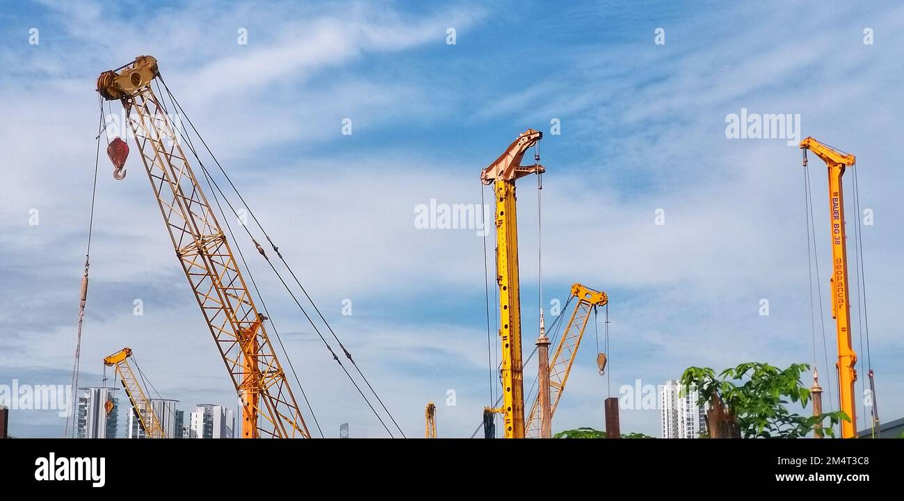 Panorama view of construction sites and many cranes are working in the ...