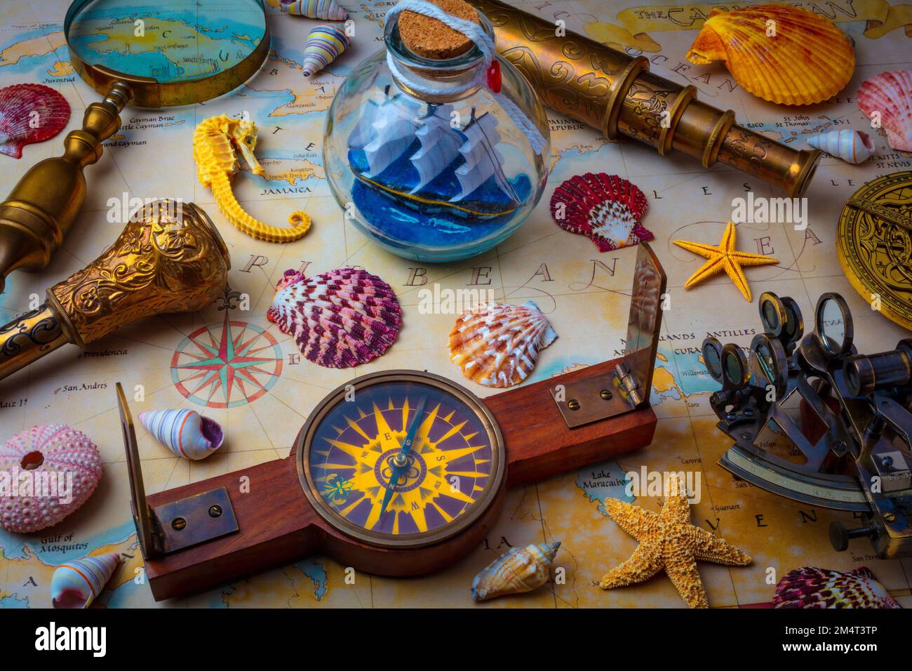 Ship In A Bottle With Compass Still Life Stock Photo - Alamy