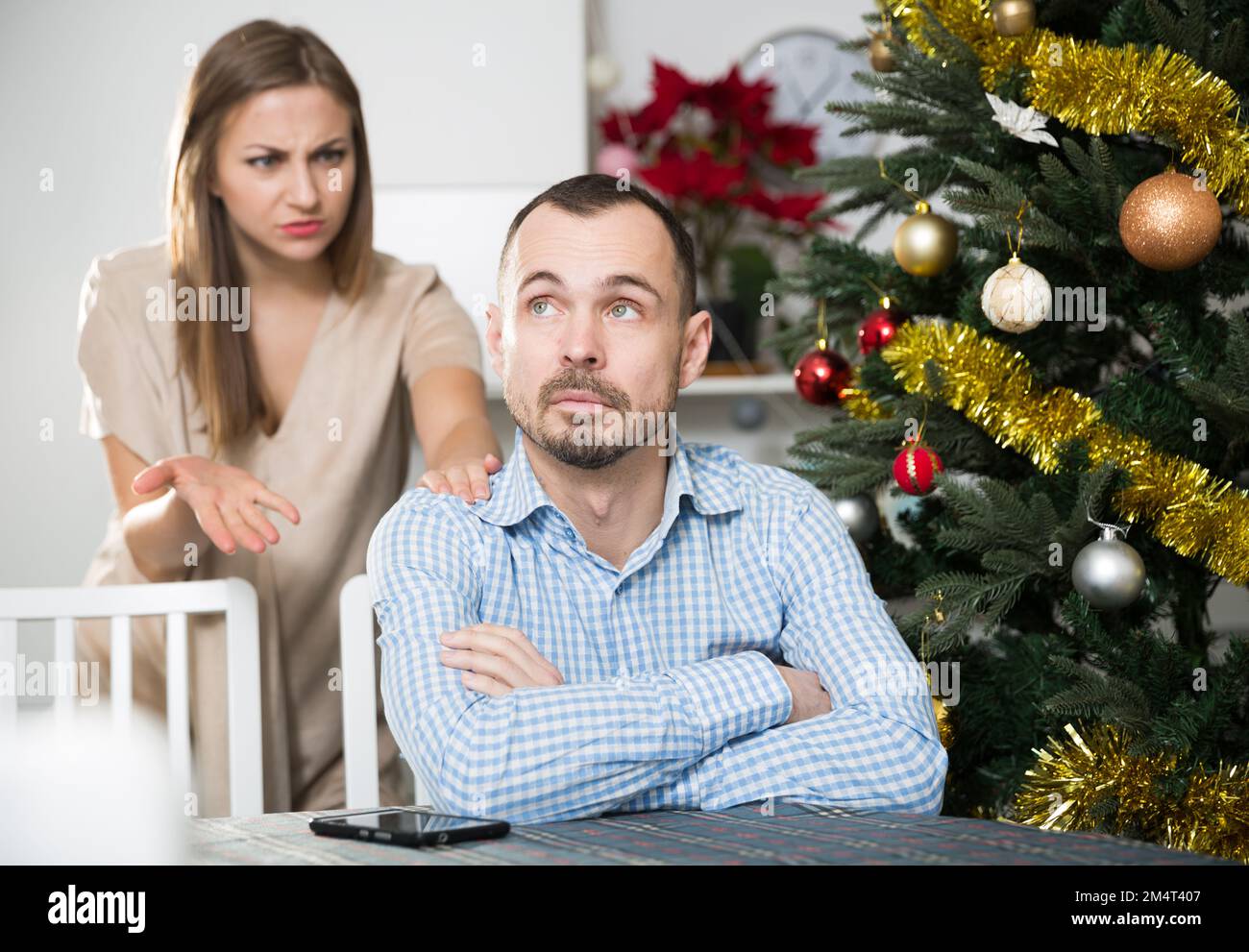 Frustrated man with disgruntled wife Stock Photo - Alamy