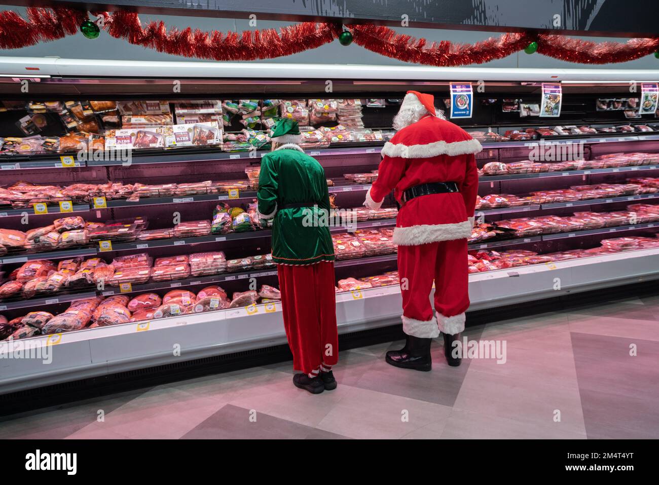 Adelaide, Australia. 23 December 2022. Shoppers dressed as Santa Claus ...