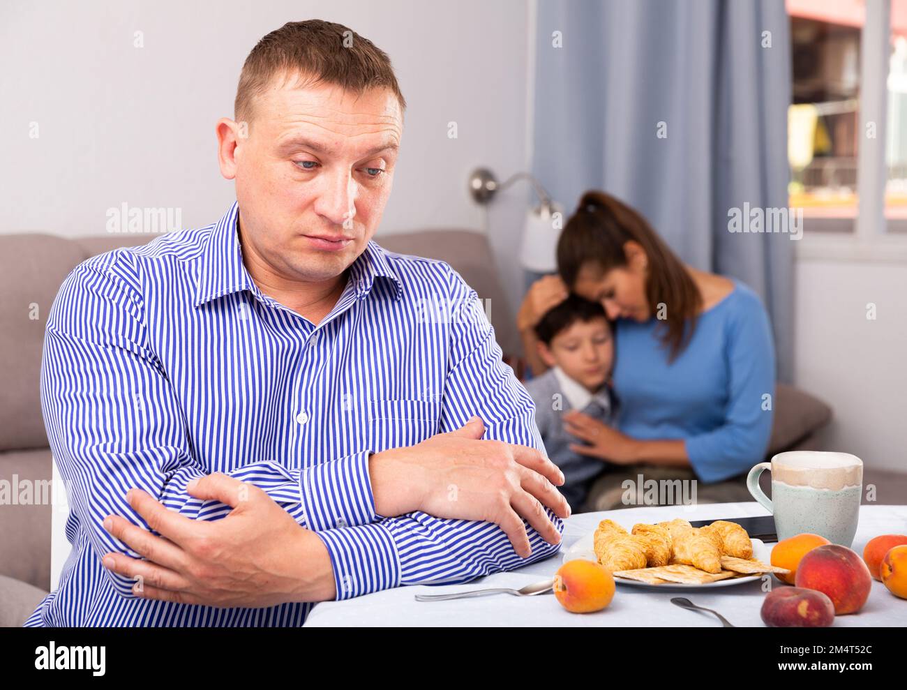 Sad man after disagreements with wife and son Stock Photo - Alamy