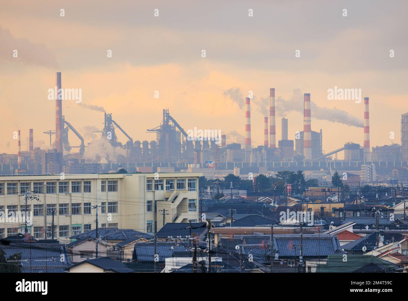 Smokestacks factory smoke over sunrise hi-res stock photography and ...