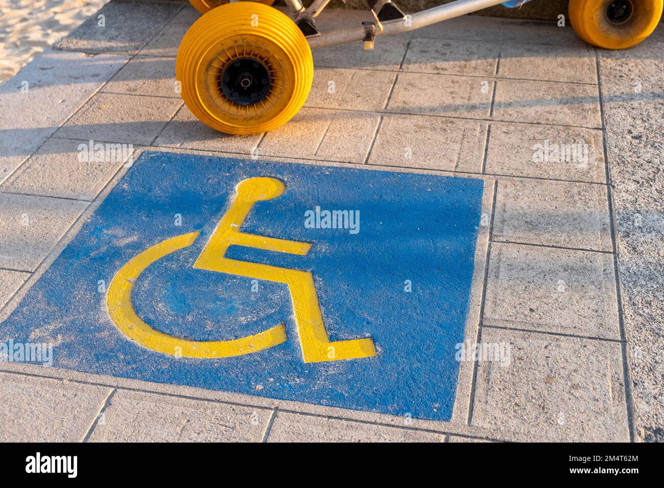 A high angle shot of a floor blue and yellow sign on the street for ...