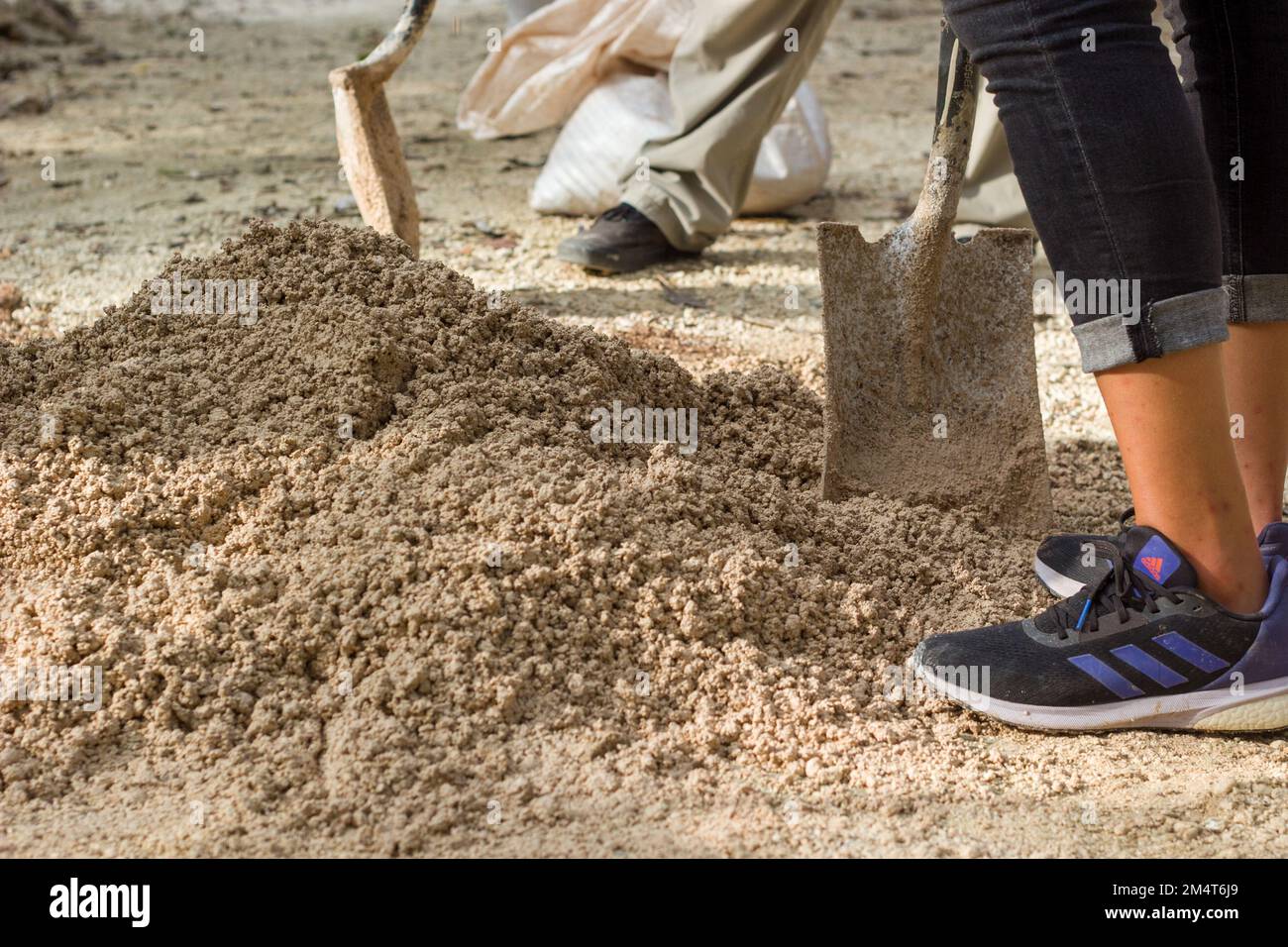 moving soil with a shove Stock Photo - Alamy