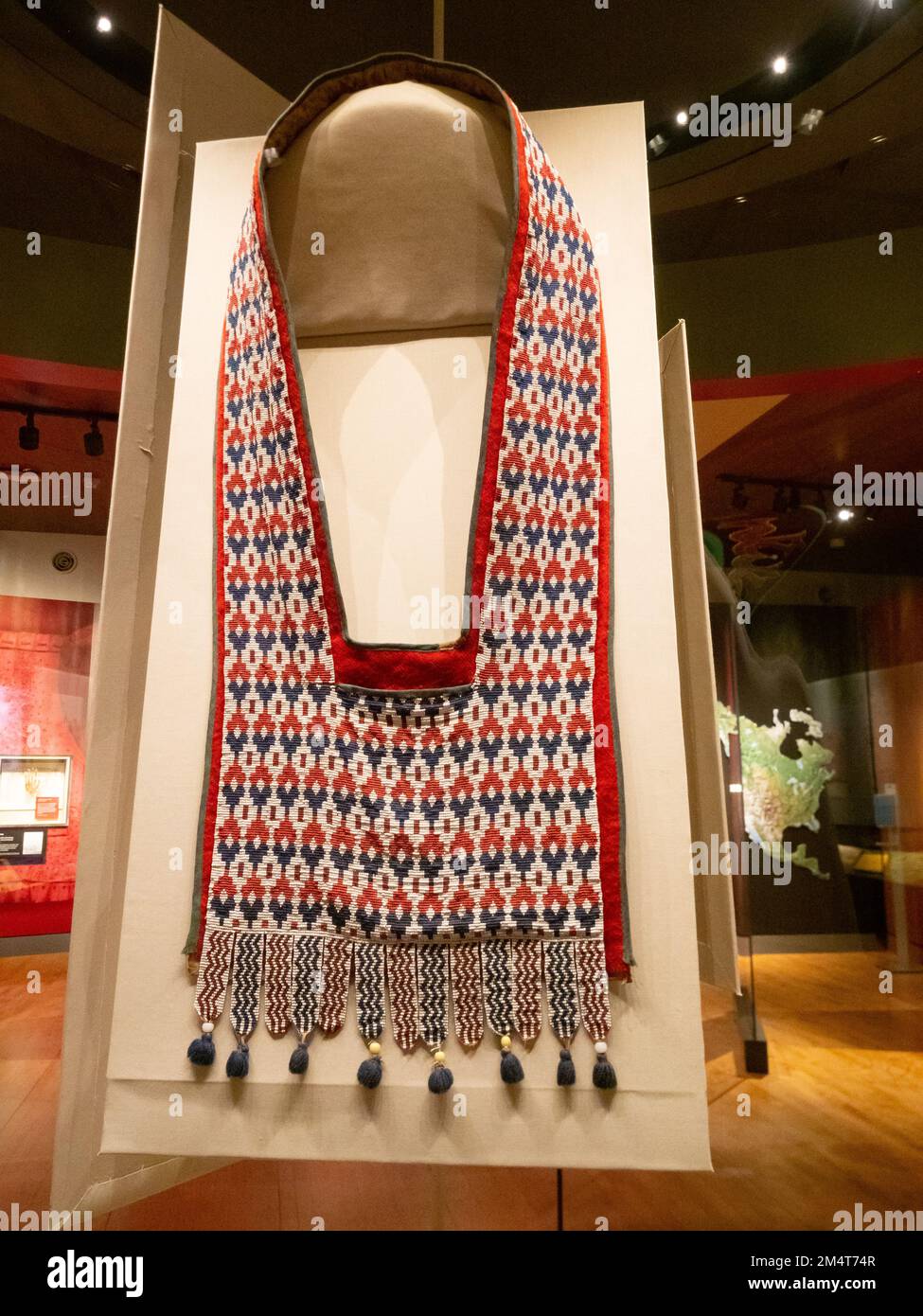 Bandolier bag with geometric design made from red, white, and blue seed ...