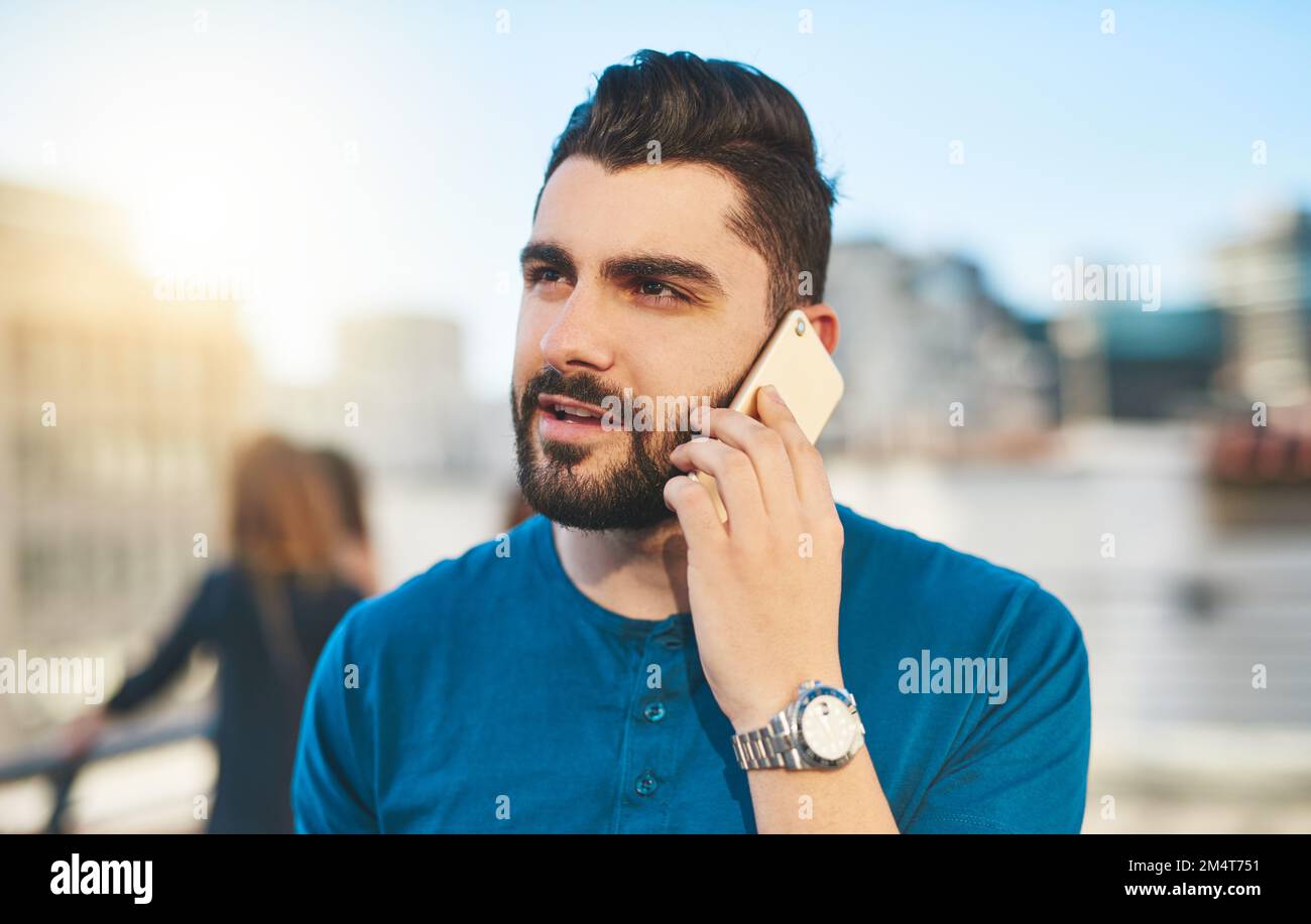 Sure, lets hear it. a handsome young man making a phone call while ...