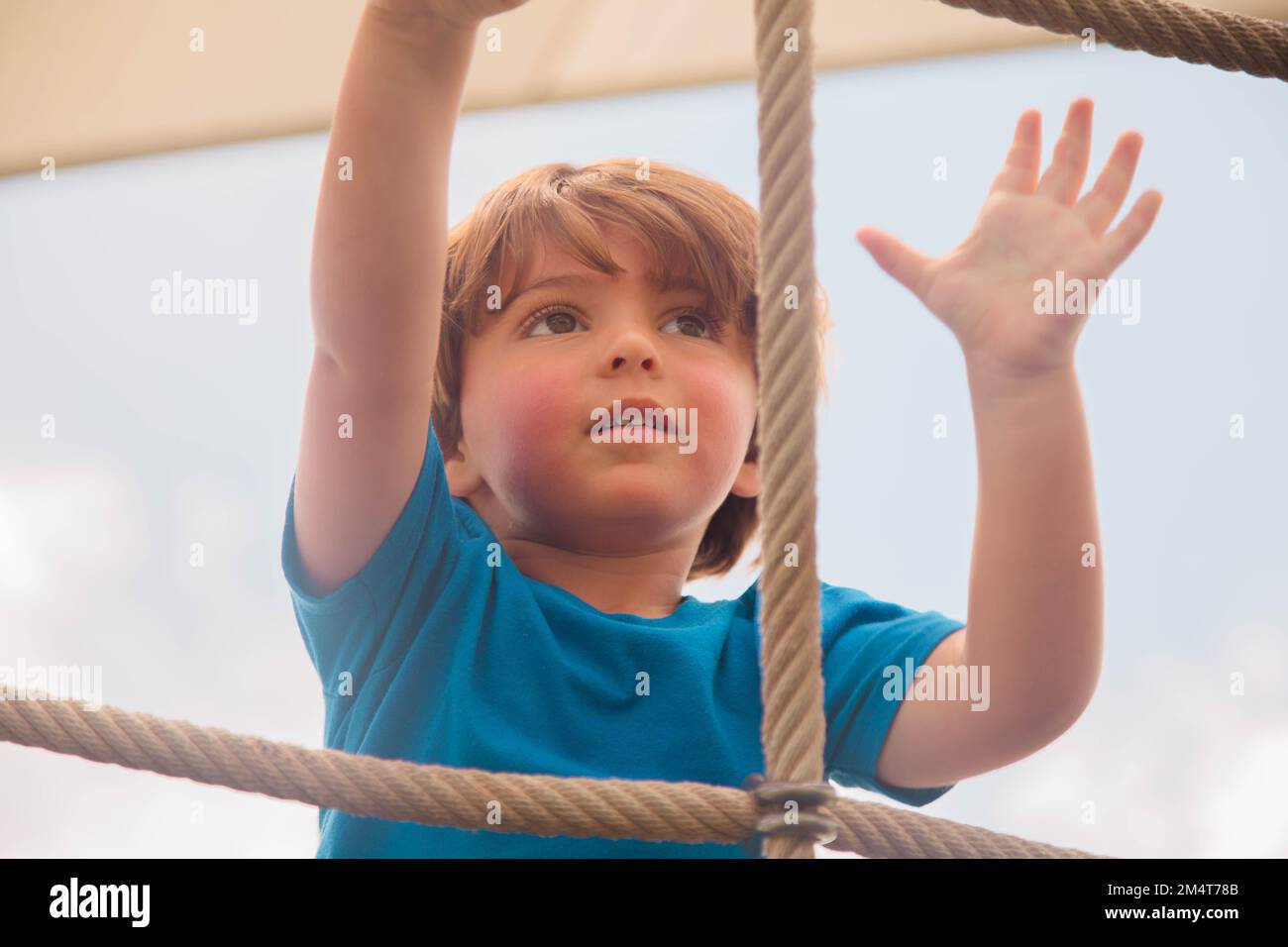 A Caucasian boy playing in the baker park in Naples, Florida Stock ...