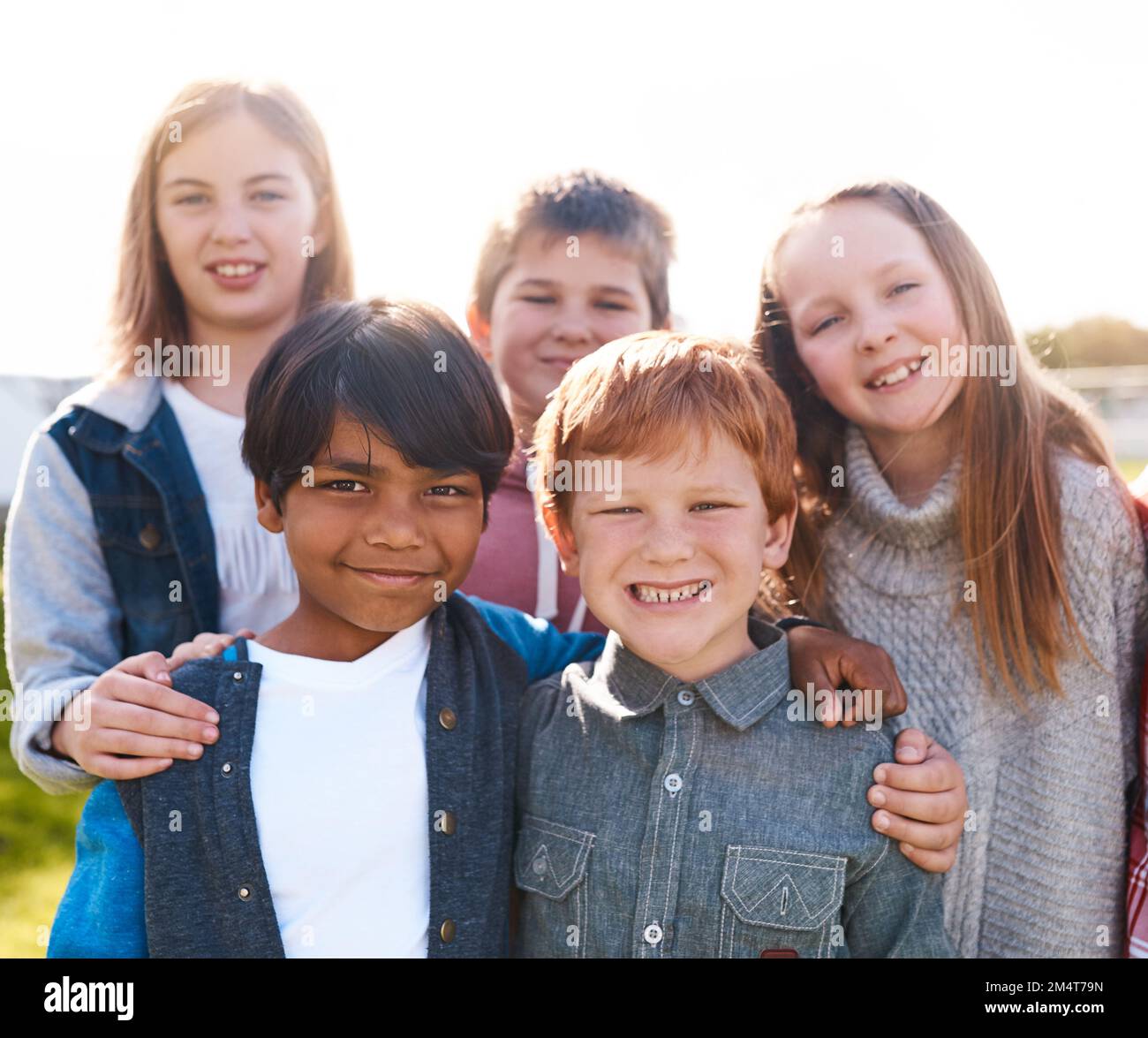 We are a tight group of friends. Portrait of a group of cheerful ...