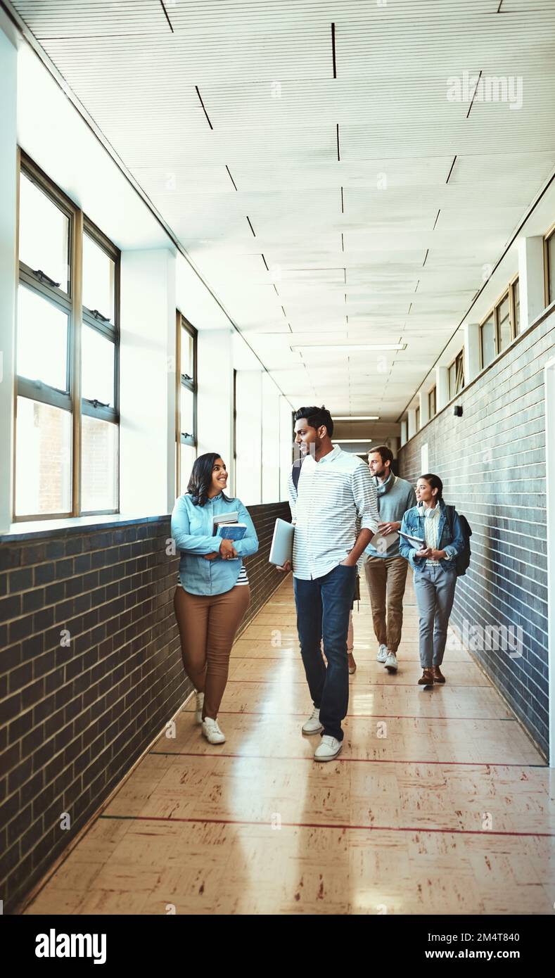 How was class. Full length shot of a group of university students ...
