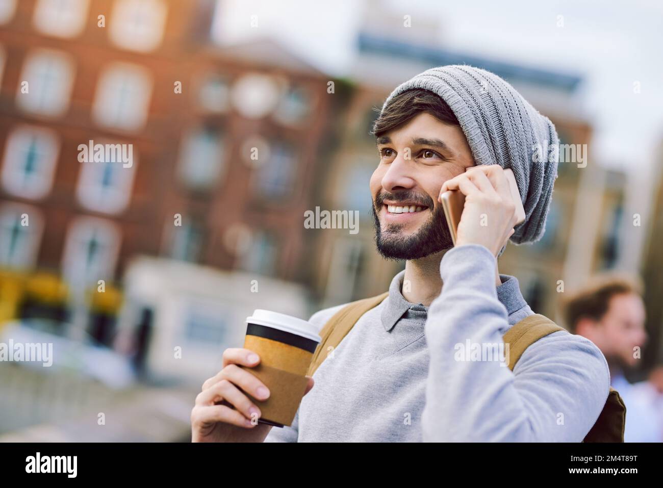 Yo, where you at. a young man using his mobile phone while out in the ...