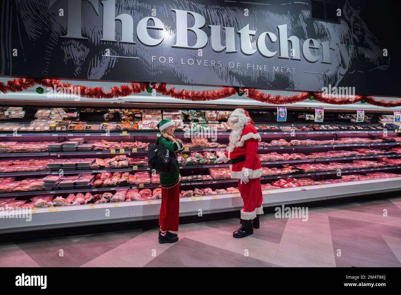 Adelaide, Australia. 23 December 2022. Shoppers dressed as Santa Claus ...