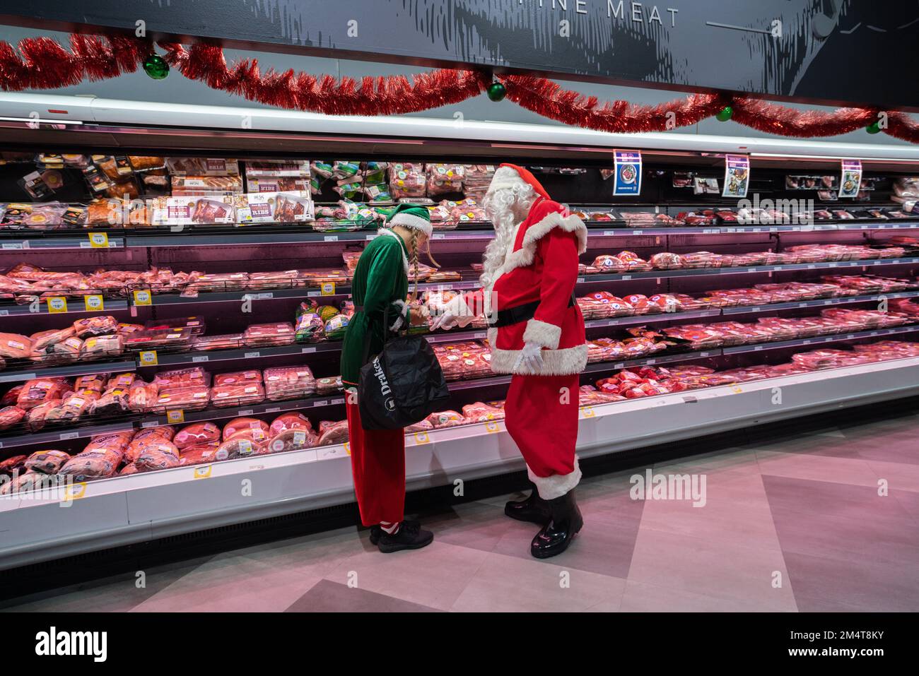 Adelaide, Australia. 23 December 2022. Shoppers dressed as Santa Claus ...