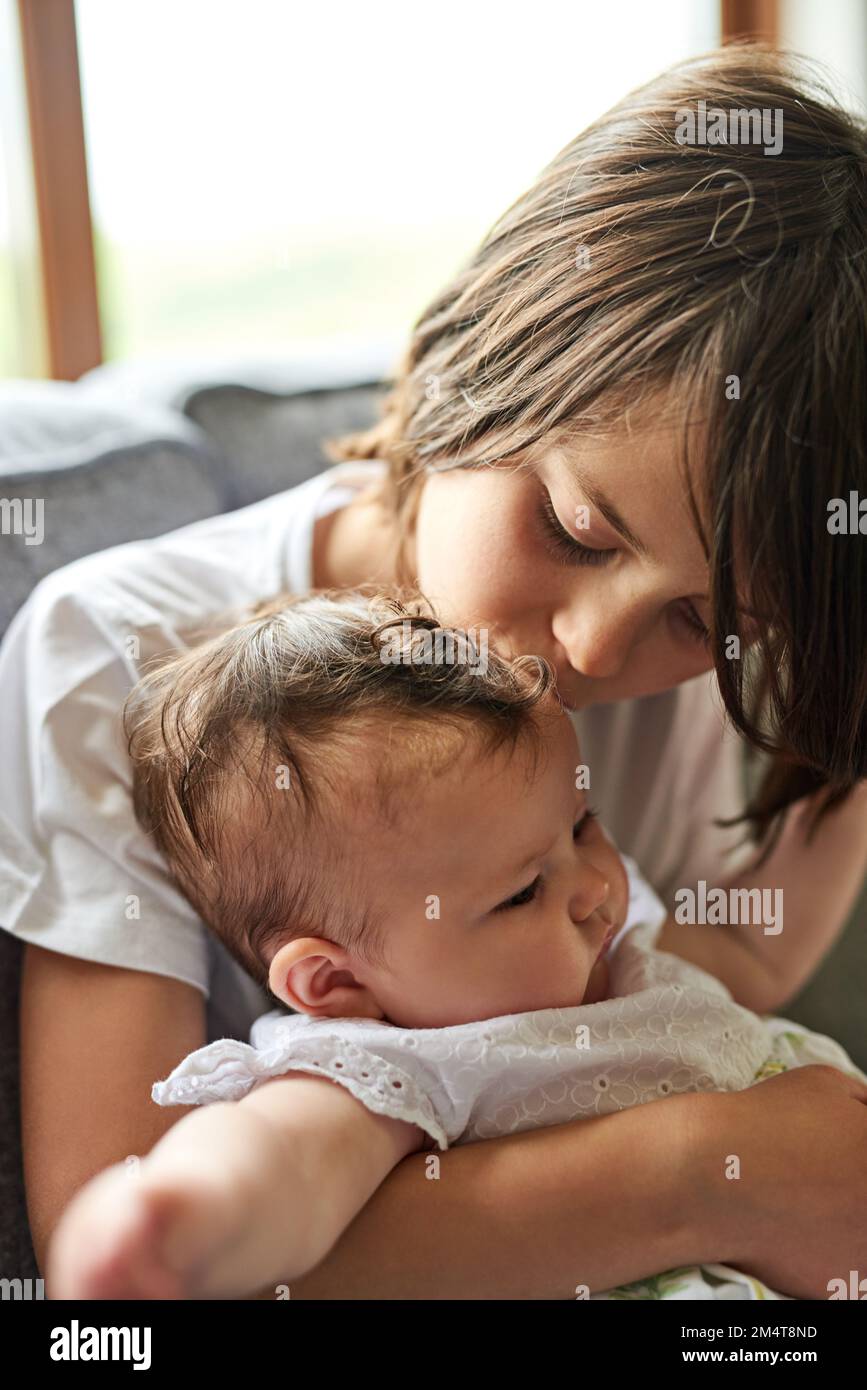 Being the best brother he can be. a little boy bonding with his baby ...