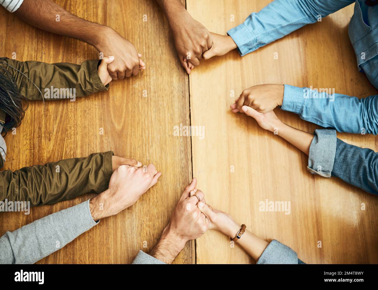 Saying a little prayer for finals week. High angle shot of a group of ...