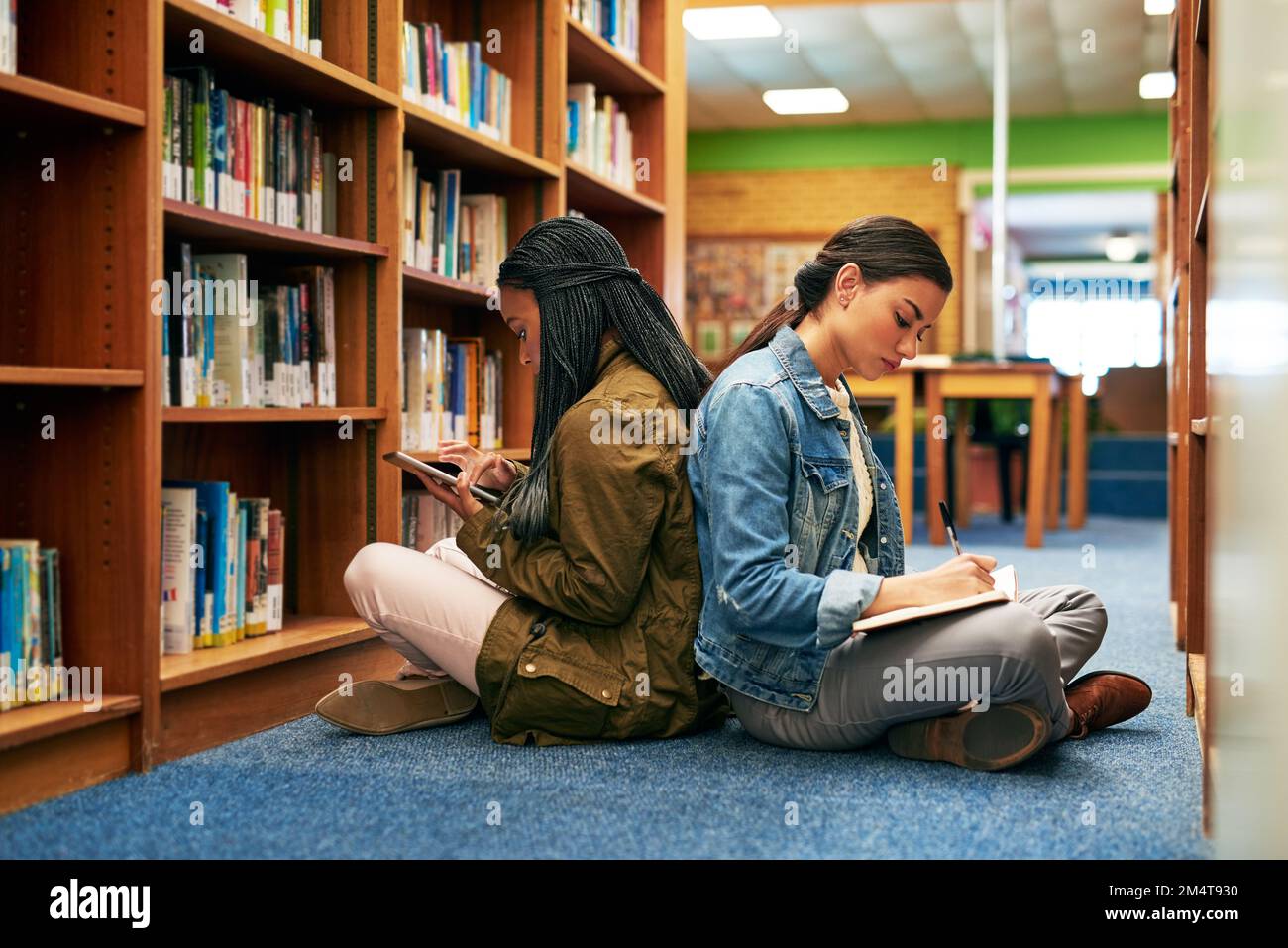 Supporting each other through their studies. High angle shot of two ...