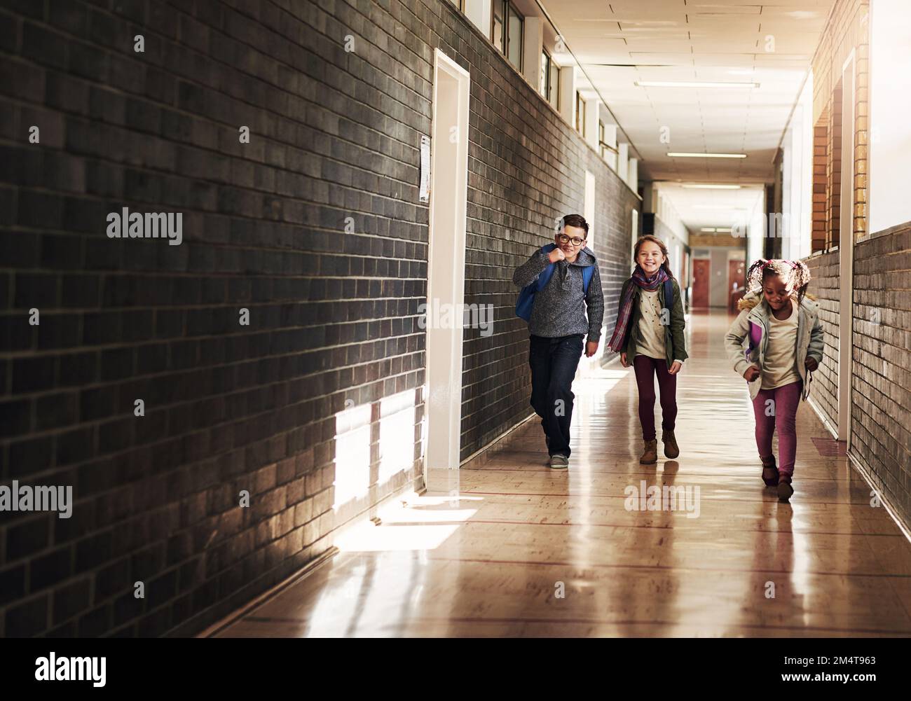 Home time finally. Full length shot of a group of elementary school ...