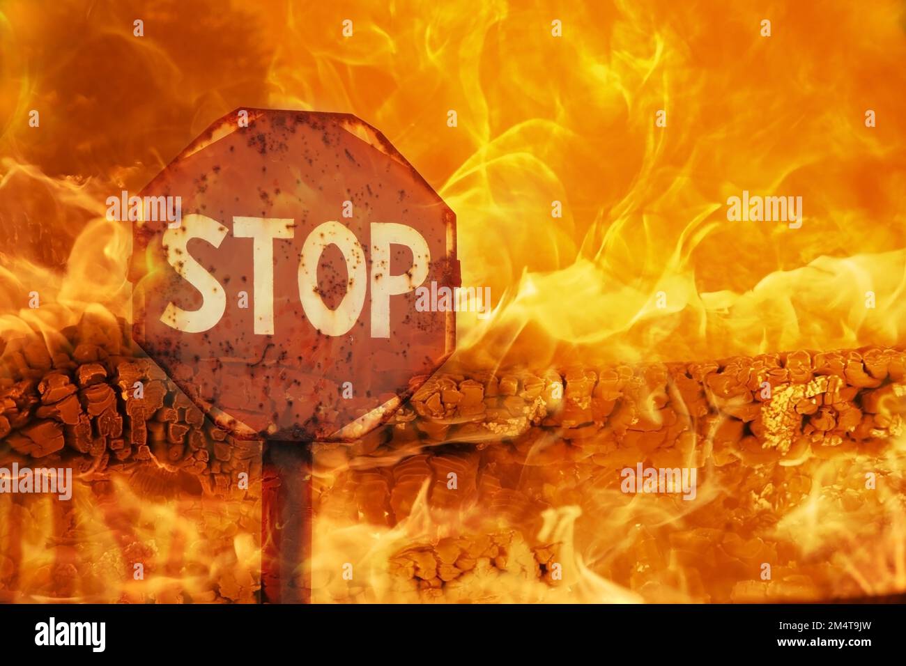 road stop sign in flame of fire as background, sign warning of danger ...