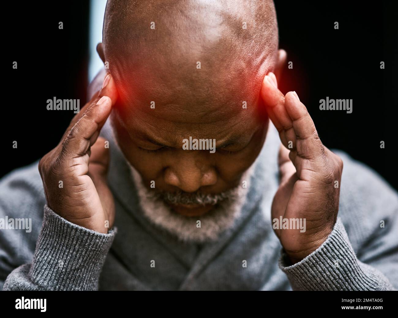 This headache is killing me. a handsome senior man rubbing his temples ...