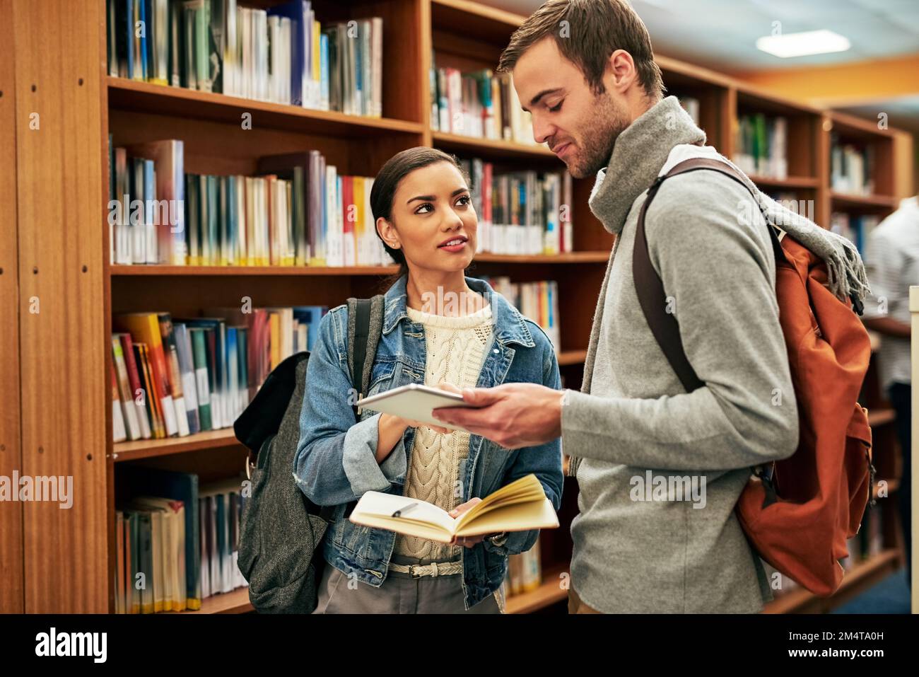 Doing some research for their group assignment. two university students ...