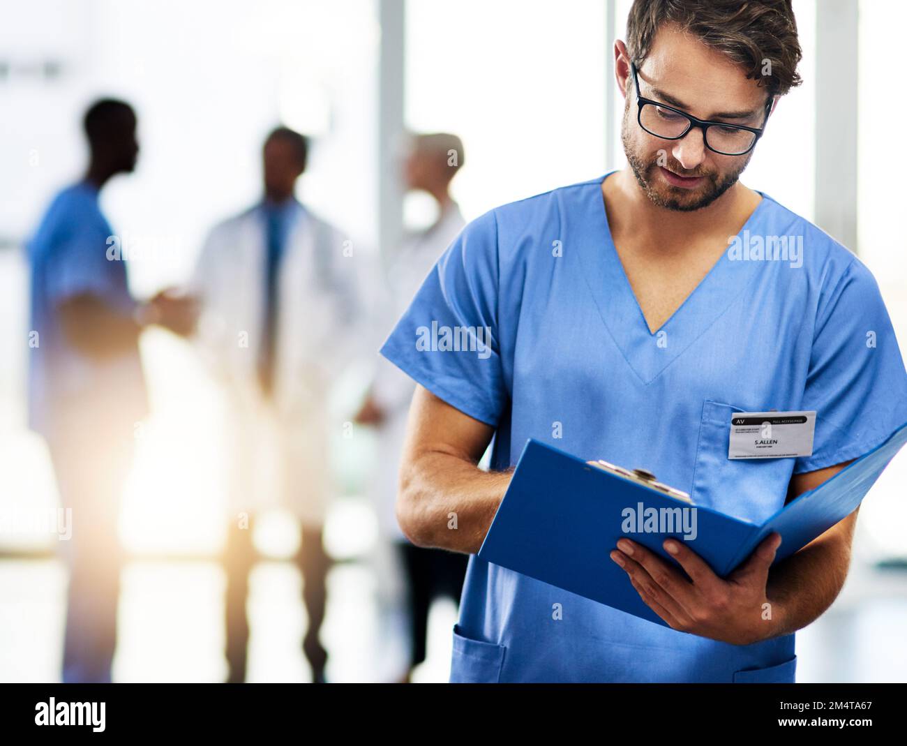 Running through his doctoring duties for the day. a young doctor ...