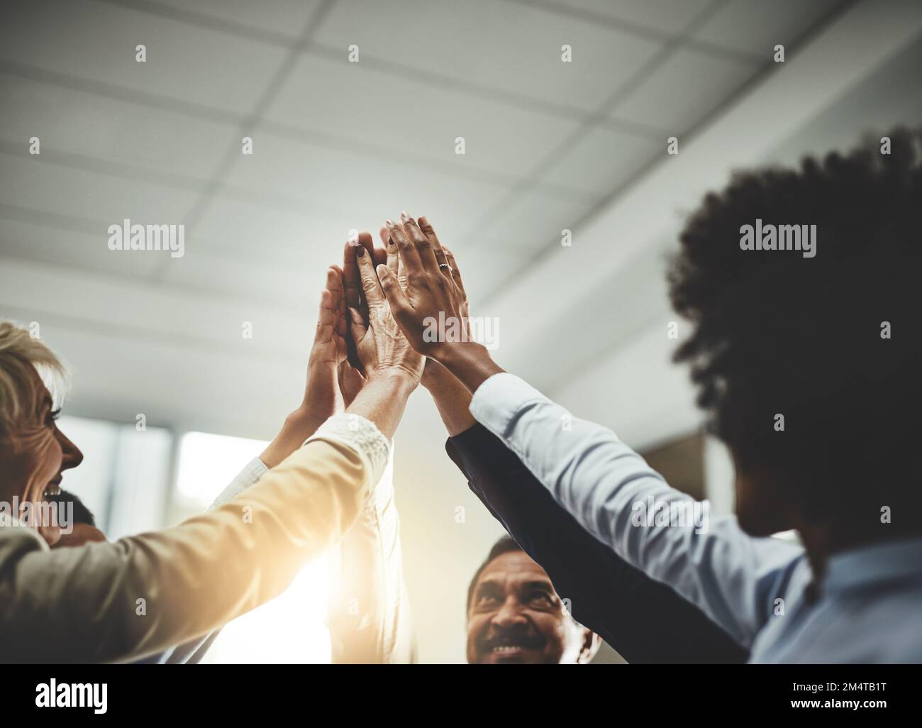 Great teams dont just happen. a group of colleagues giving each other a ...