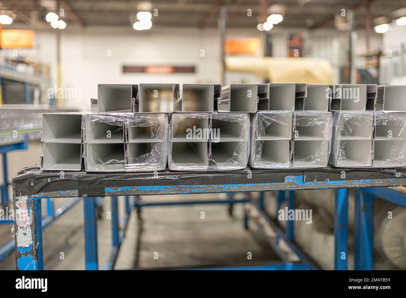 Metal flashing in metal roofing factory workshop Stock Photo - Alamy