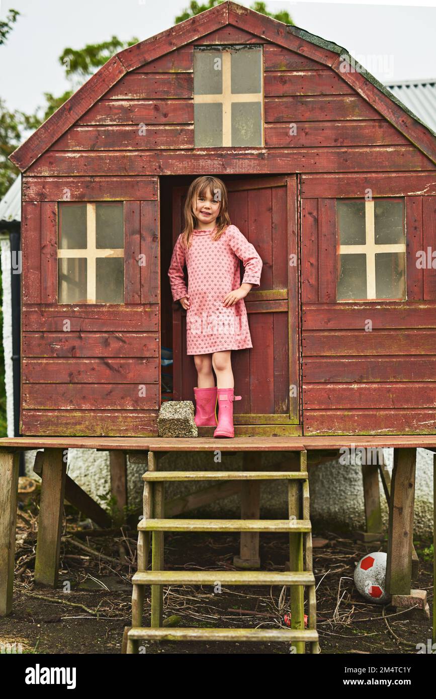 Its not a shed, its my castle. Portrait of an adorable little girl ...