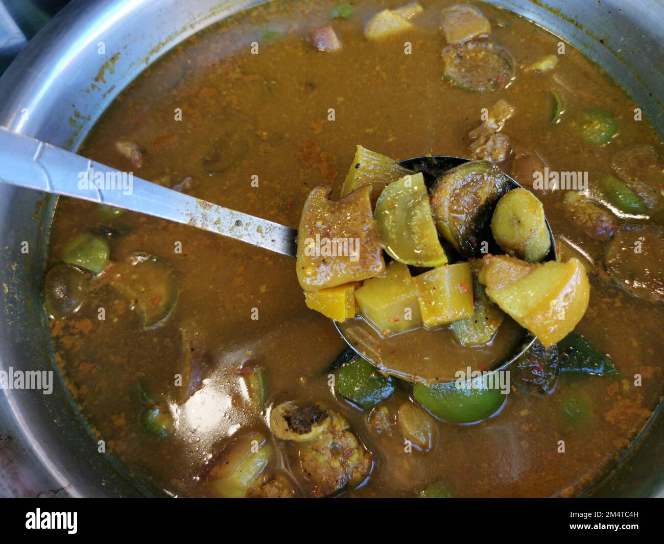 Southern Thai style food Kaeng Tai Pla. A spicy curry with meat in a ...