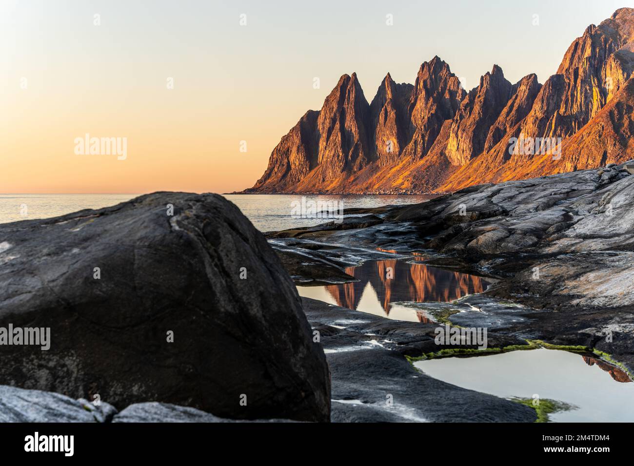 A scenic view of Devils teeth mountains in Senja, Norway, at bright ...