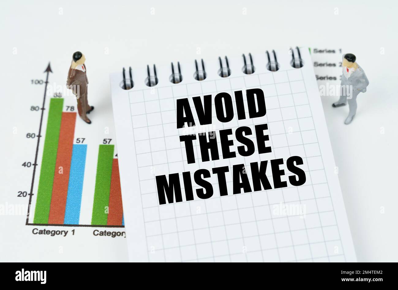 Business and finance concept. On the chart there are miniature figures ...