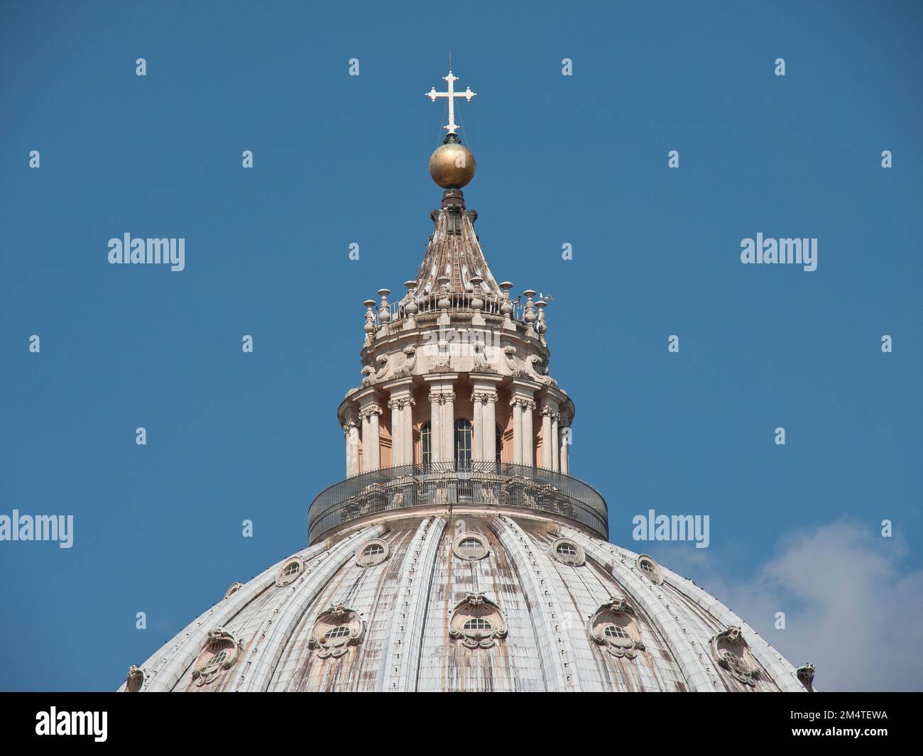 The golden cross on the dome of the Papal Basilica of Saint Peter under ...