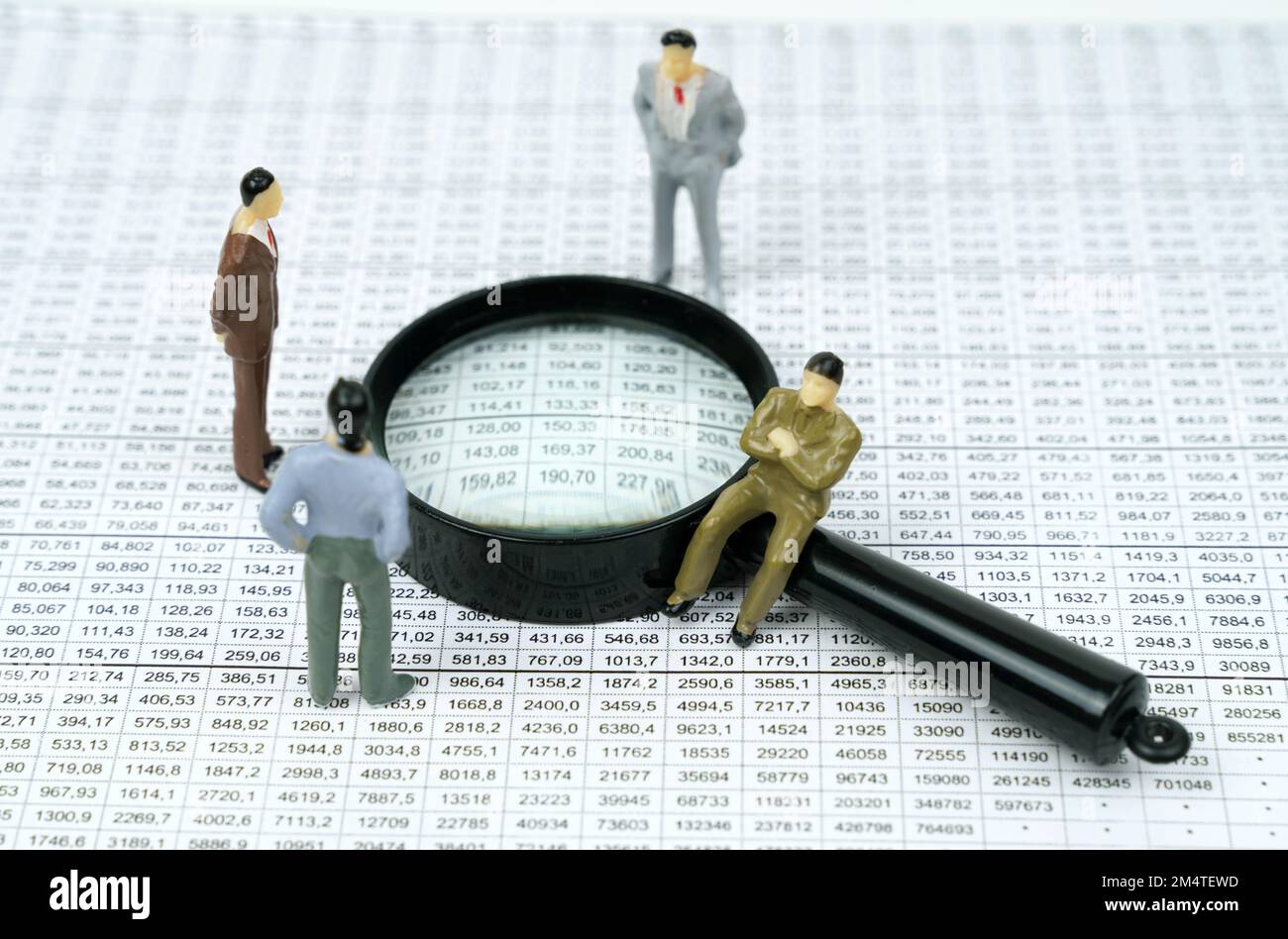 Business concept. There is a magnifying glass on the financial reports ...