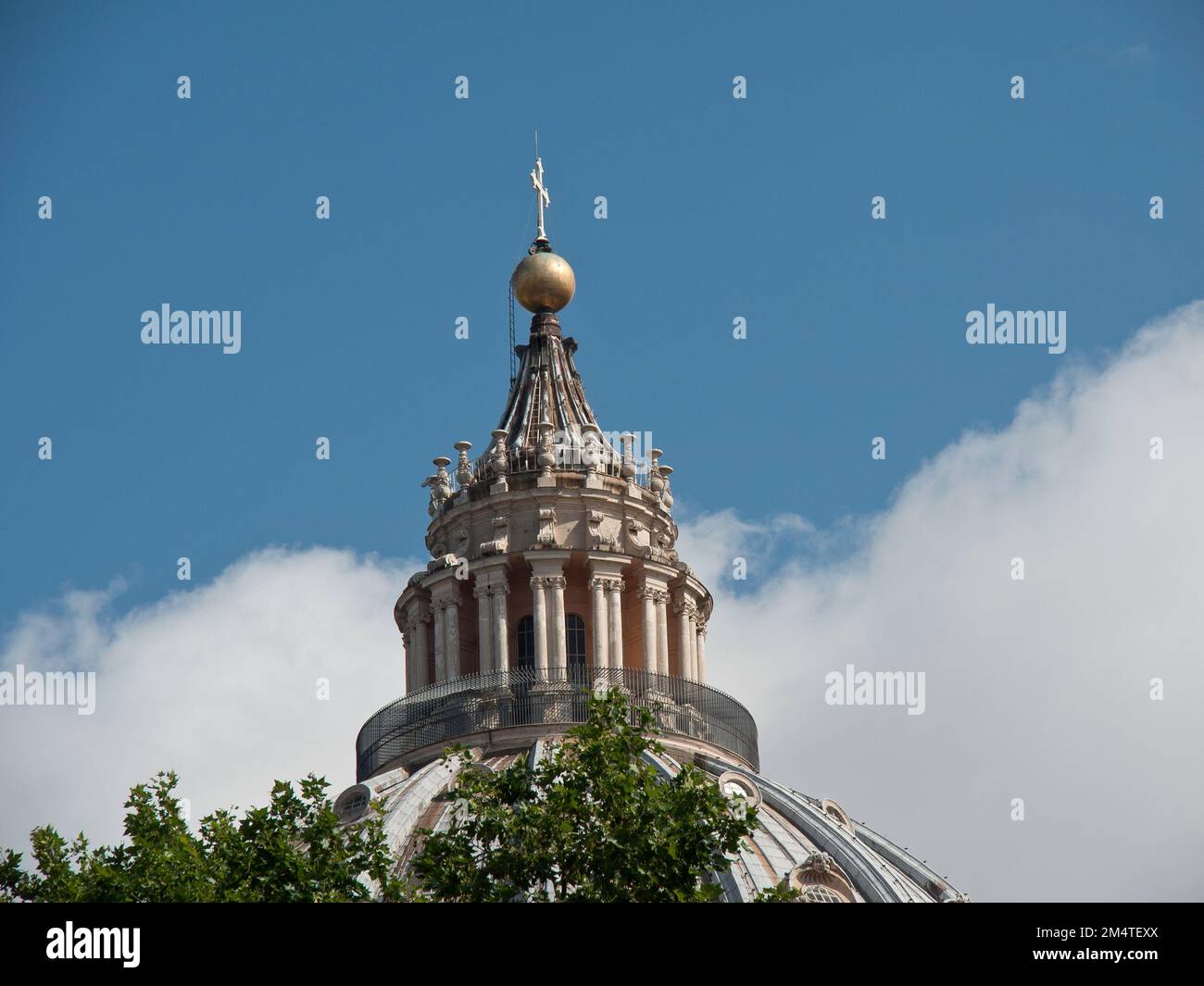 The golden cross and the architectural detail on the dome of the Papal ...