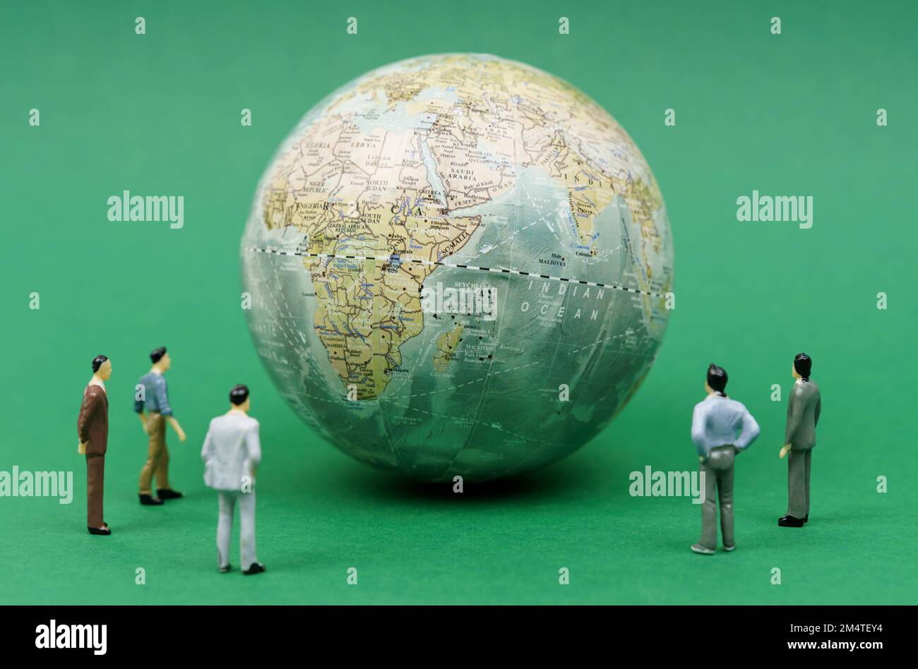 Ecology concept. On the green surface is a planet around which there ...