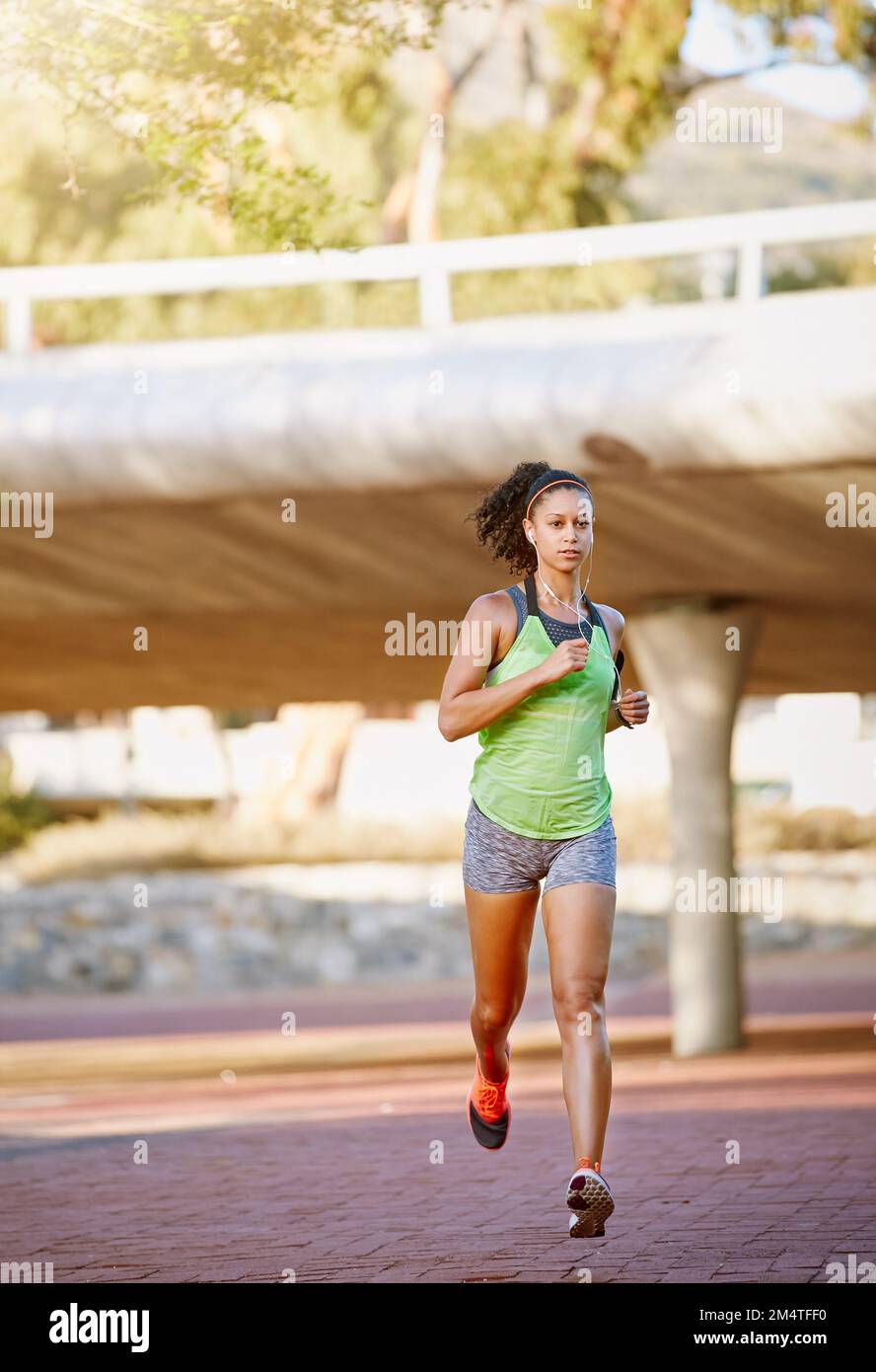 The further you go, the stronger youll get. a sporty young woman out ...